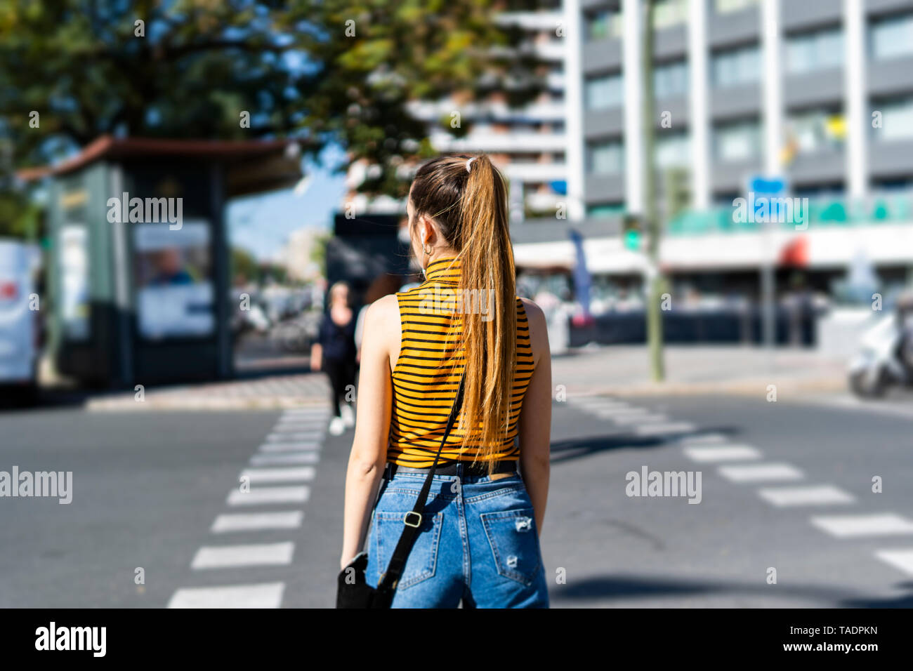 Back view of teenage girl on the street in summer hi-res stock ...