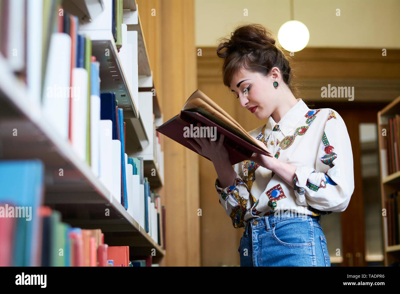 Female student studying library hi-res stock photography and images - Alamy