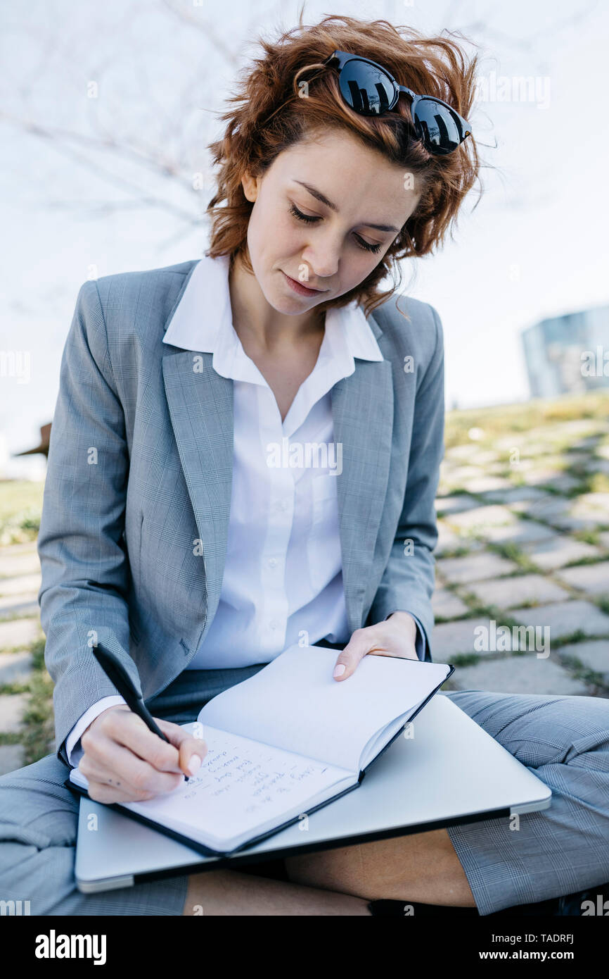 Sitting writing sunglasses communication hi-res stock photography and ...