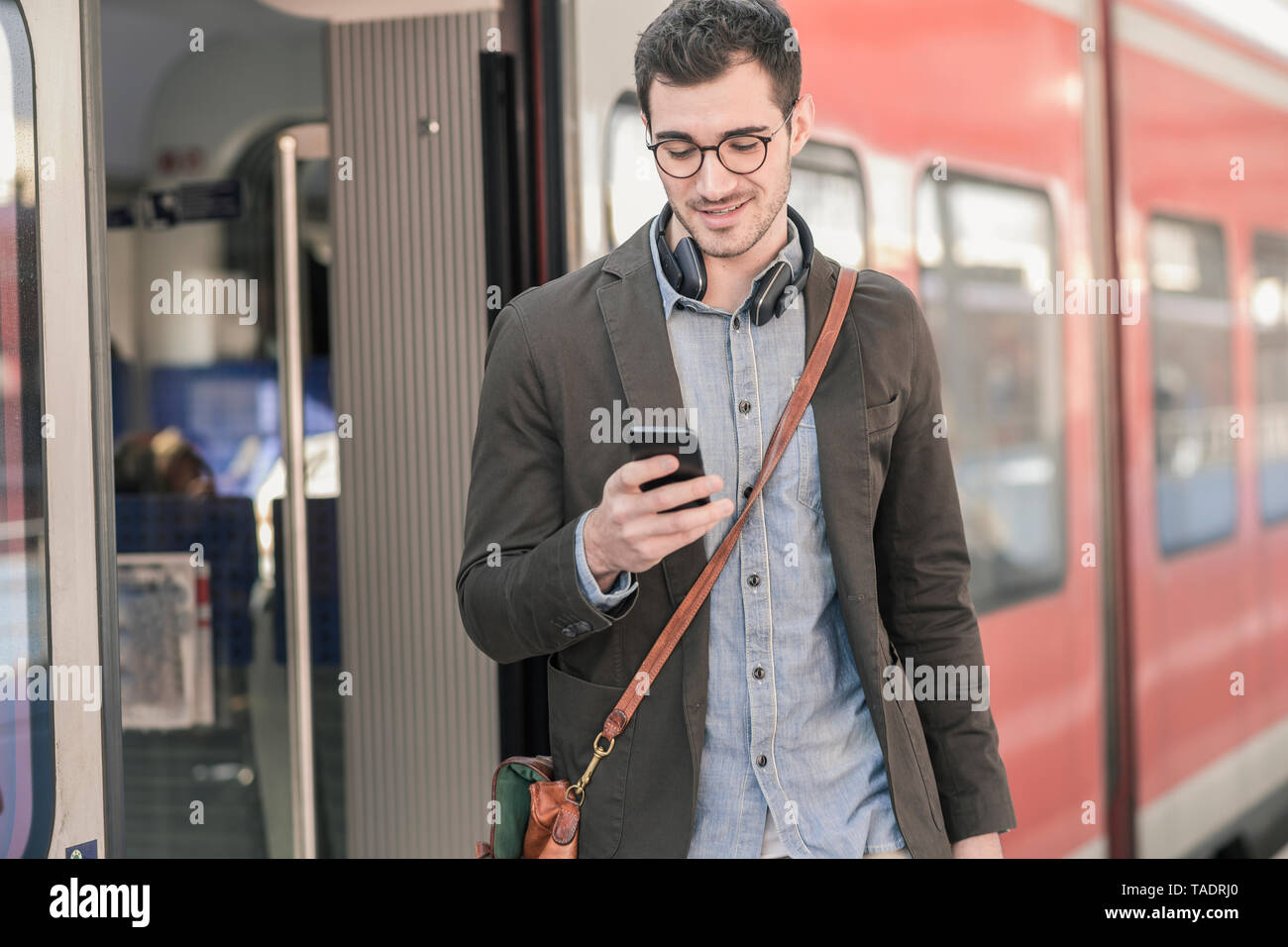 Young man commuter train hi-res stock photography and images - Alamy