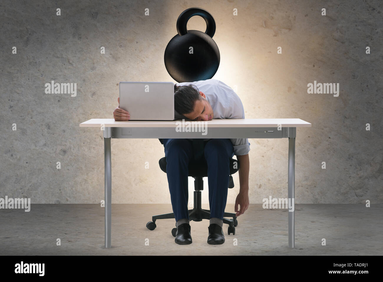 Employee with burden of work Stock Photo - Alamy