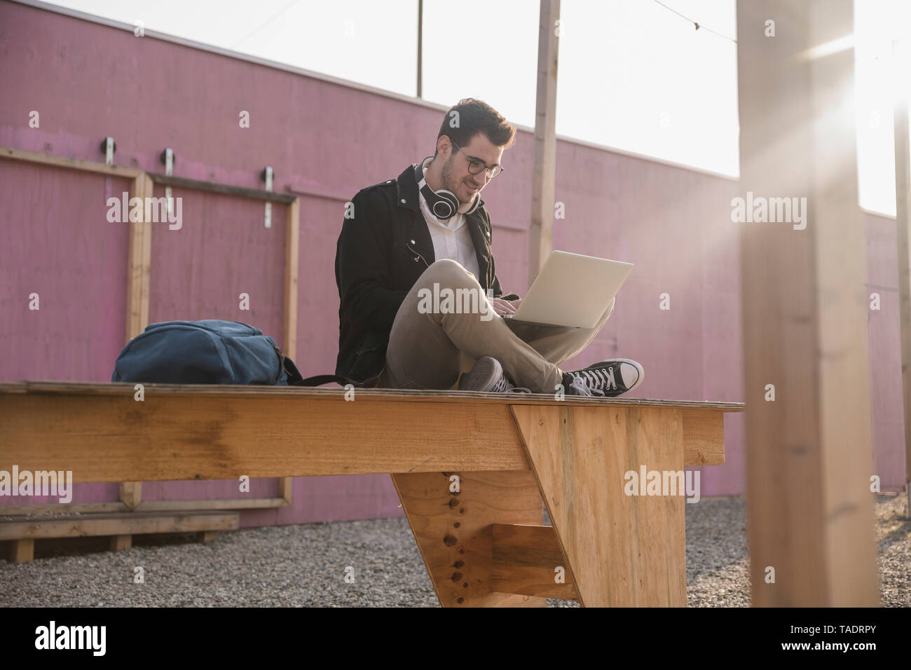 Young man sitting on platform hi-res stock photography and images - Alamy