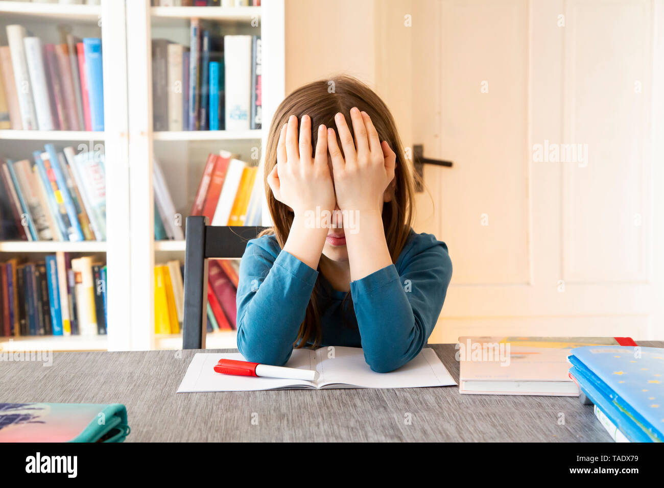 Frustrated girl with homework Stock Photo - Alamy