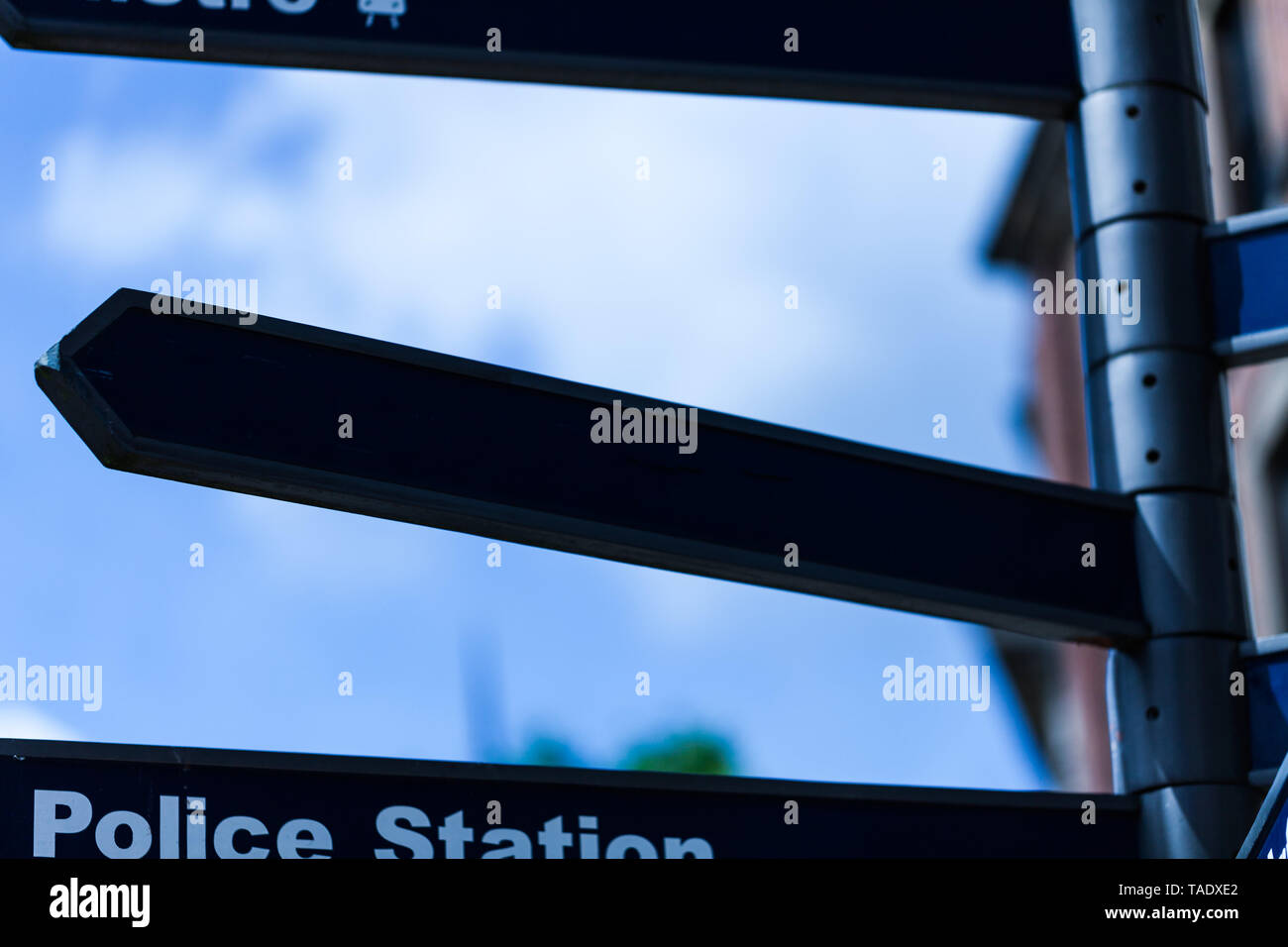 Classic Britain metal signpost two blank banners another Police Station ...