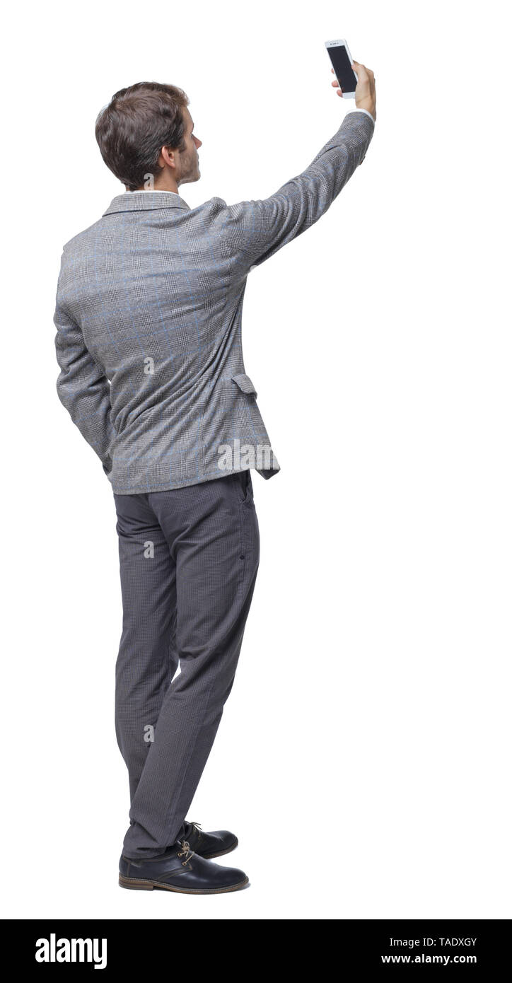 Back view of businessman in a suit making a selfie. rear view people ...