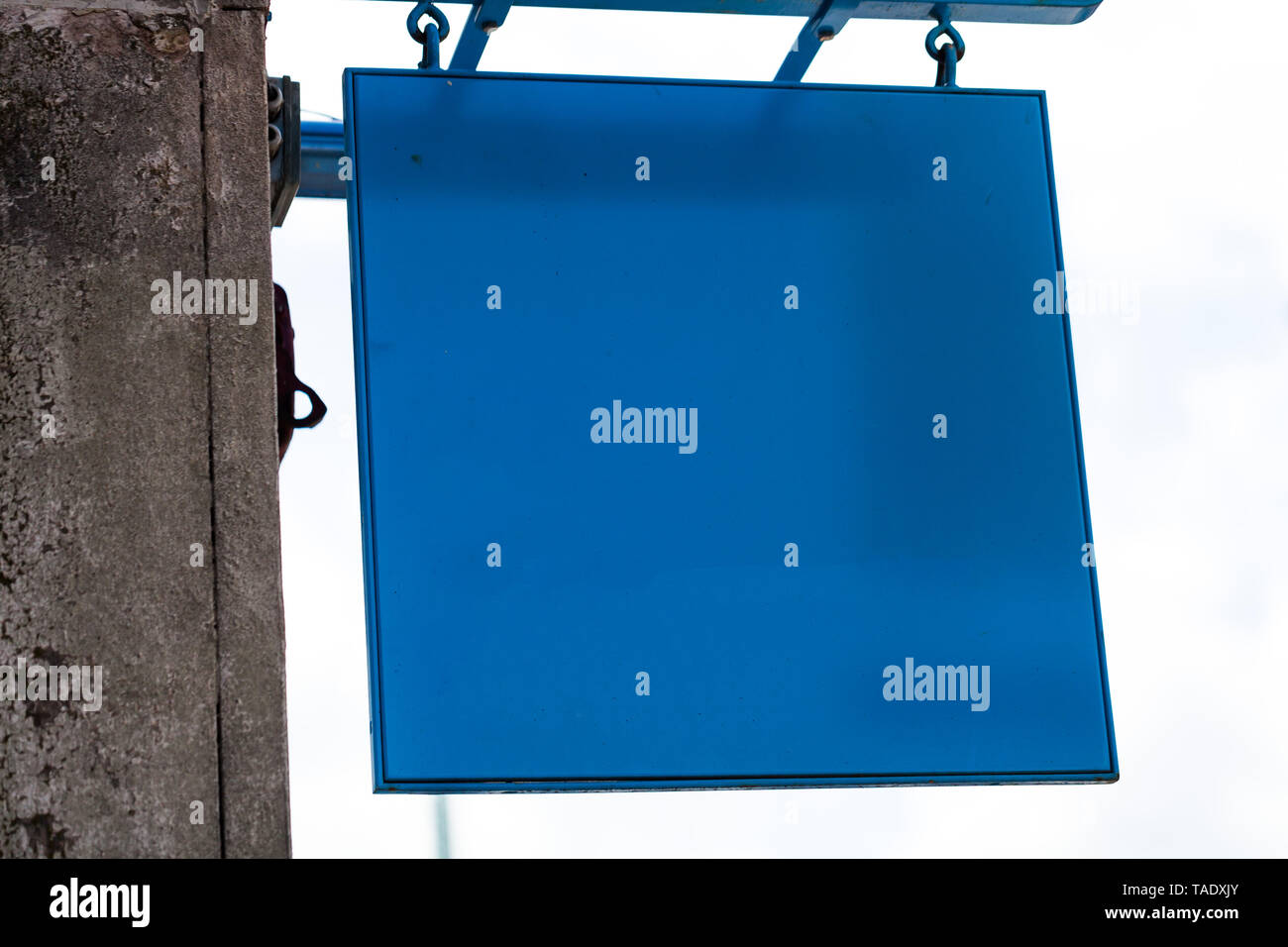 Metal rectangle sign hanging from street post blank space write ...