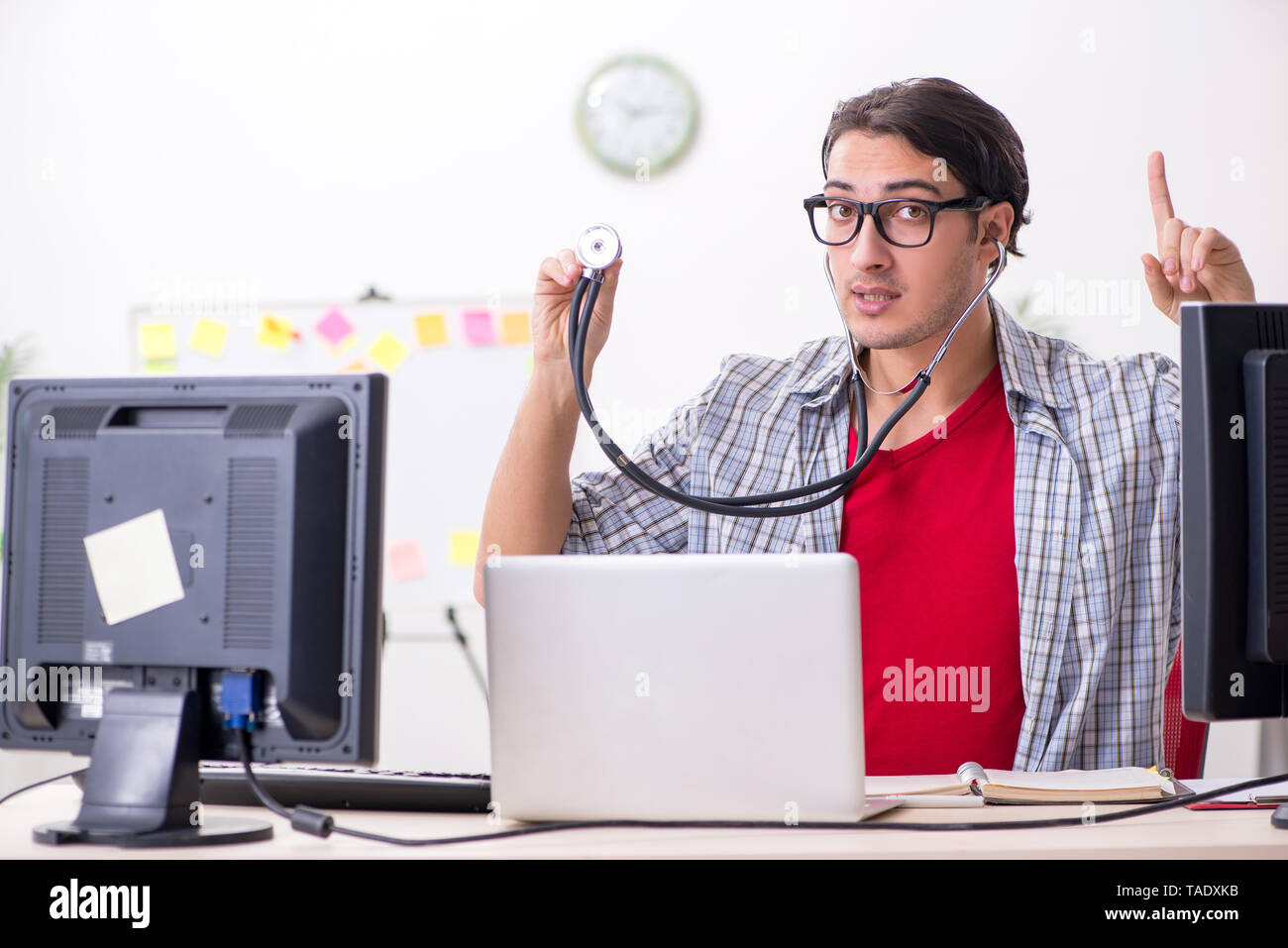 Male it specialist working in the office Stock Photo - Alamy