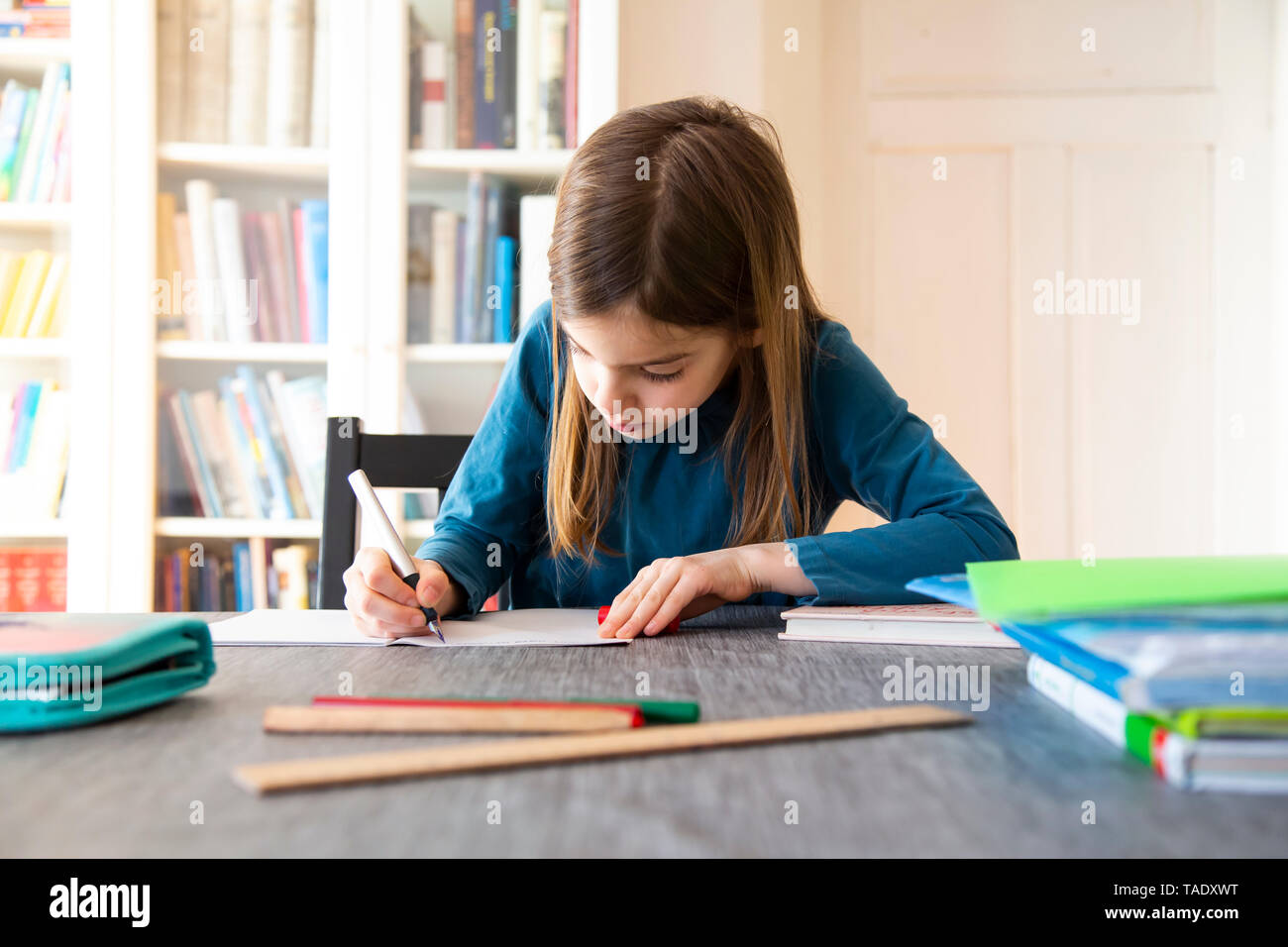 Girl doing homework Stock Photo - Alamy