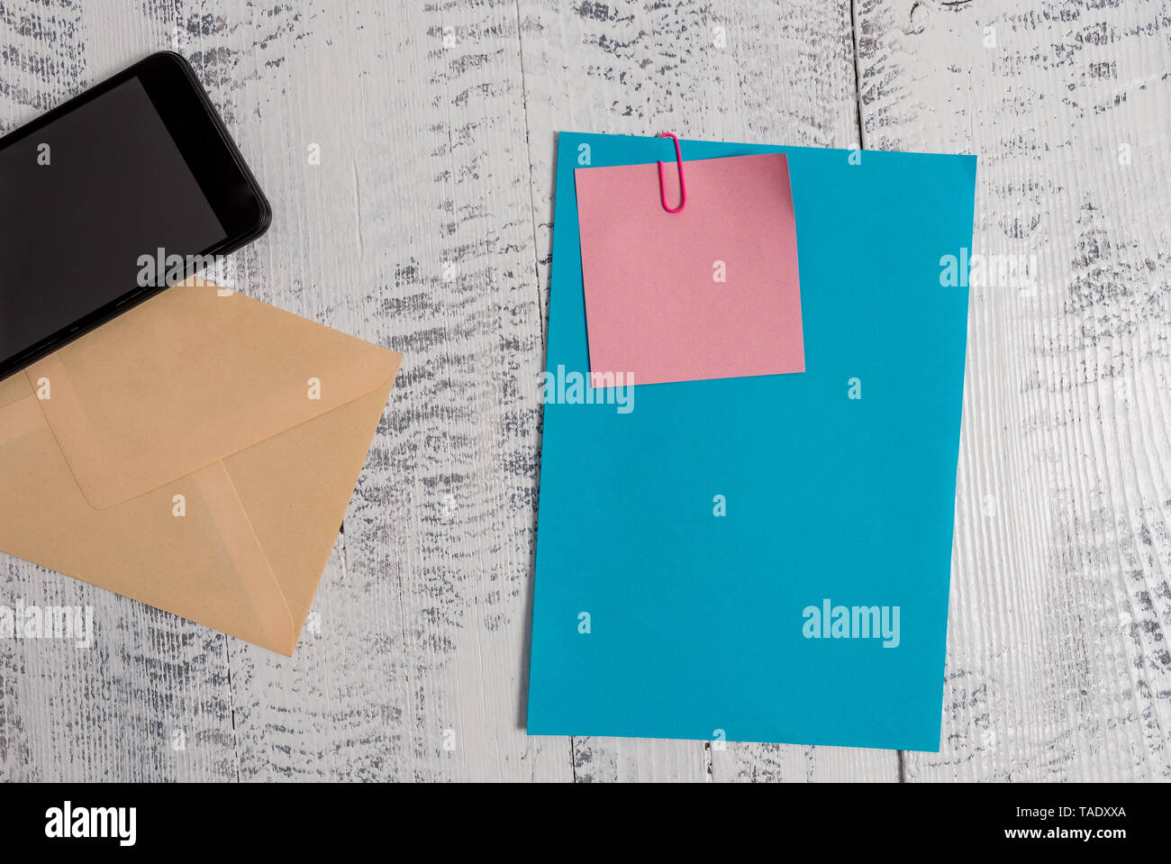 Envelope blank sheet paper sticky note smartphone wooden vintage ...