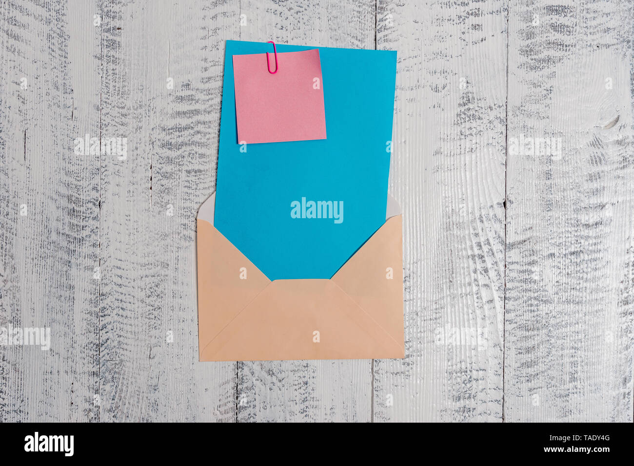 Open envelope blank letter sheet paper sticky note retro wooden ...