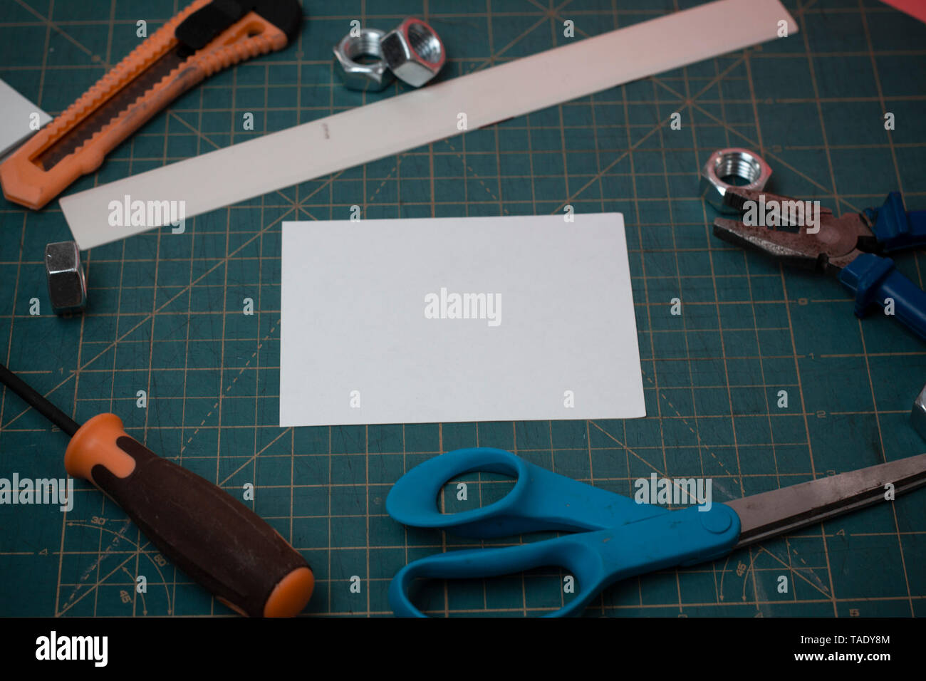 Carpentry equipments and plain paper scattered everywhere on measuring ...