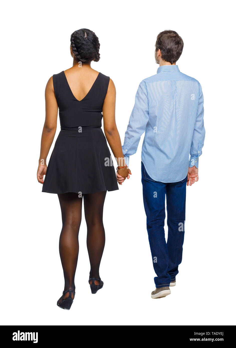 Back view of interracial going couple. walking friendly girl and guy ...