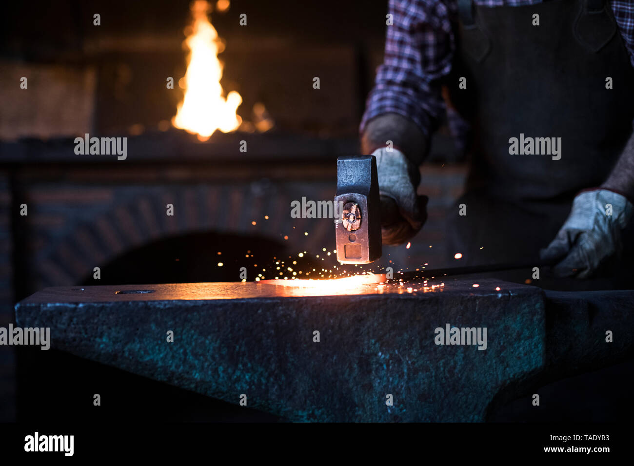 Blacksmith working at the anvil hi-res stock photography and images - Alamy
