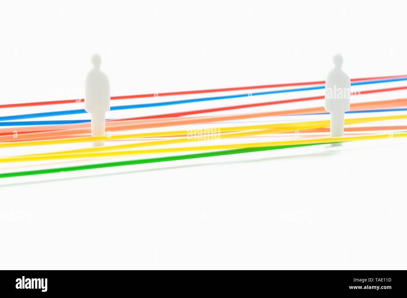 White figurines and colorful Stock Photo - Alamy