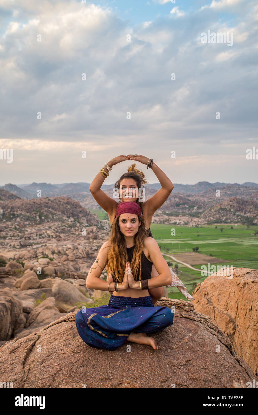 Two beautiful hippie girls at sunset Stock Photo - Alamy