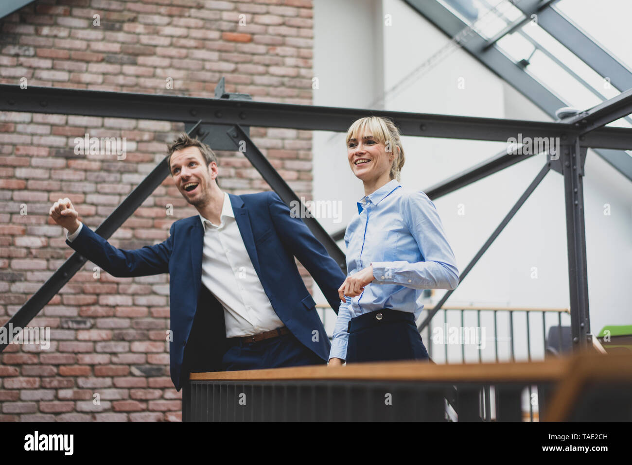 Businessman laughing office railing hi-res stock photography and images ...