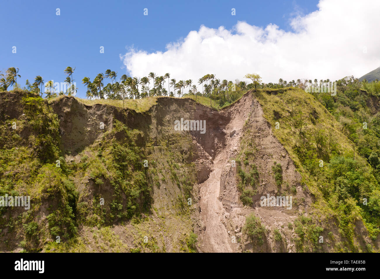 The collapse of the soil in the mountains. Landslide of sand and stones ...