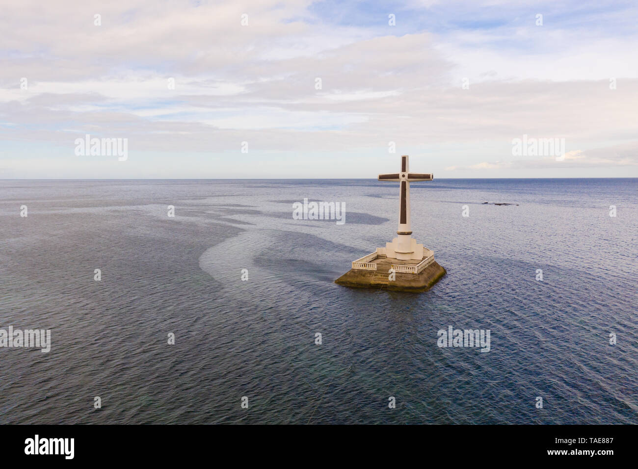 Catholic cross in a flooded cemetery in the sea near the island of ...