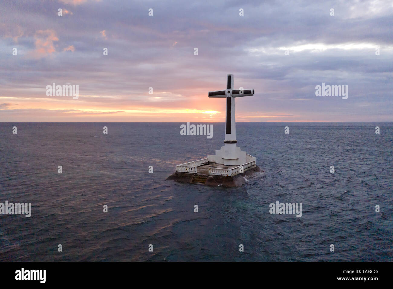 Catholic cross in a flooded cemetery in the sea near the island of ...