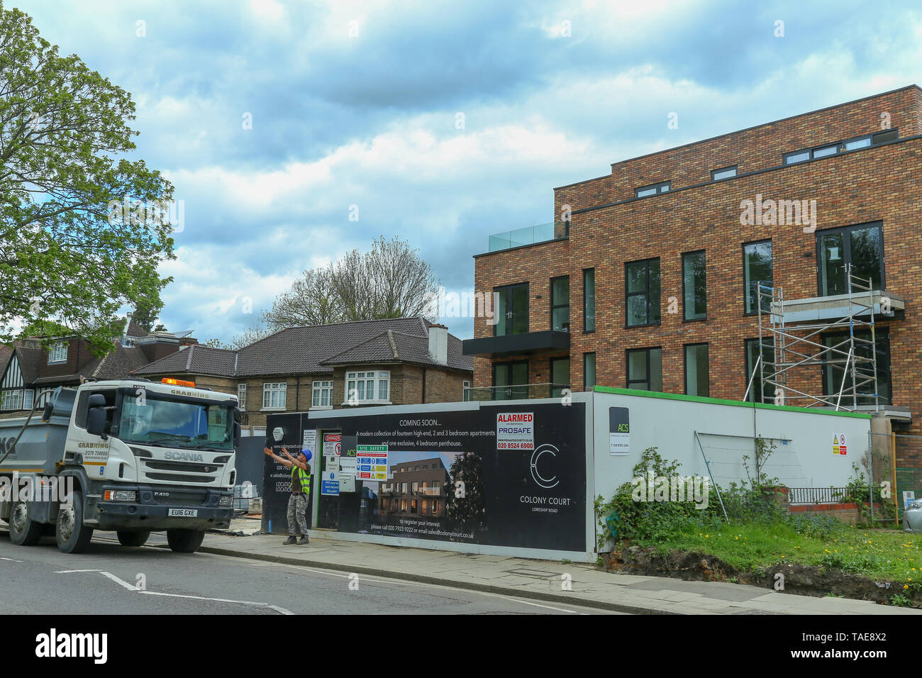 Truck and workers out of a new building. Gentrification in Hackney ...