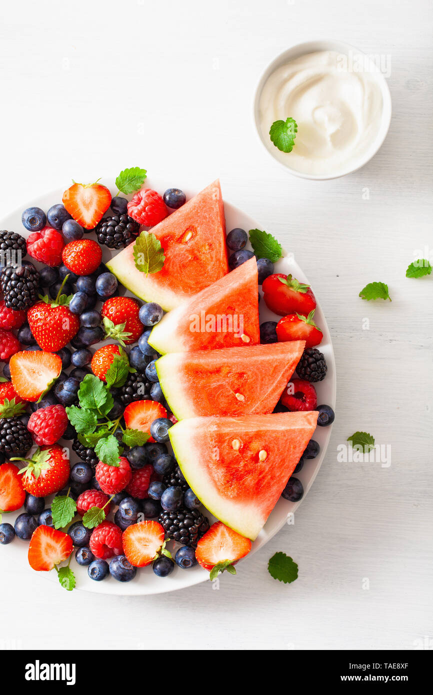 fruit and berry platter over white. blueberry, strawberry, raspberry ...