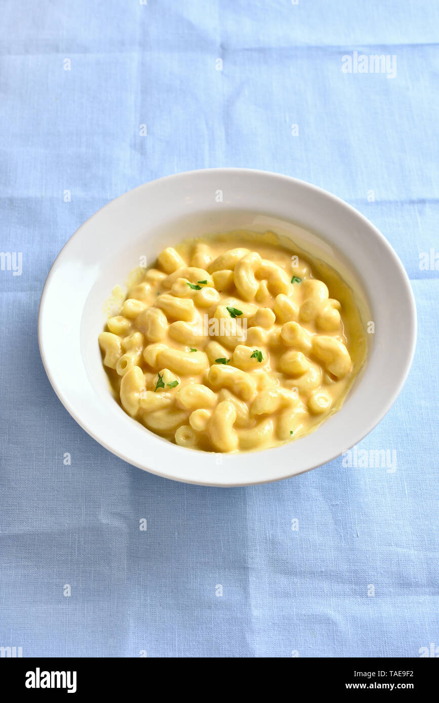 Pasta, macaroni and cheese in white bowl. Tasty dish for dinner Stock ...