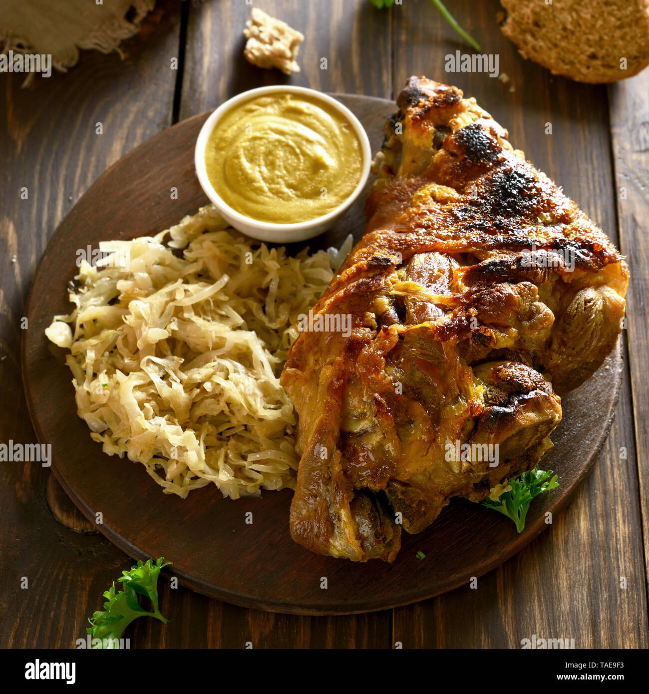 Roasted pork knuckle (eisbein) with braised cabbage (sauerkraut) and ...