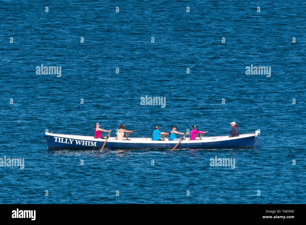 Tilly Whim boat travels across Swanage Bay on a hot sunny day in Dorset ...