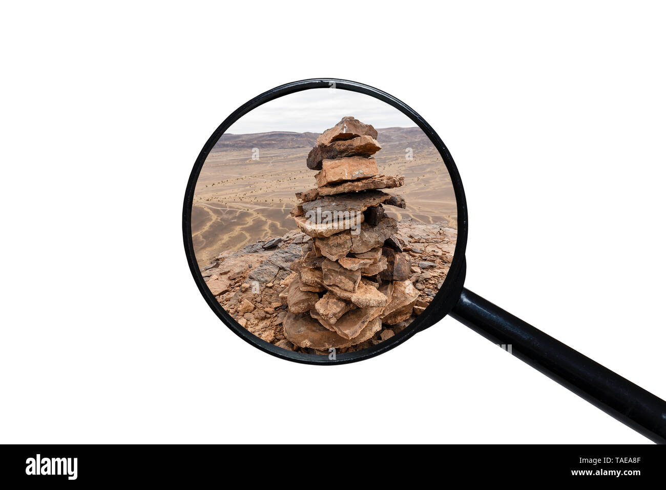 Stone pile mark on the mountain peak, view through a magnifying glass ...