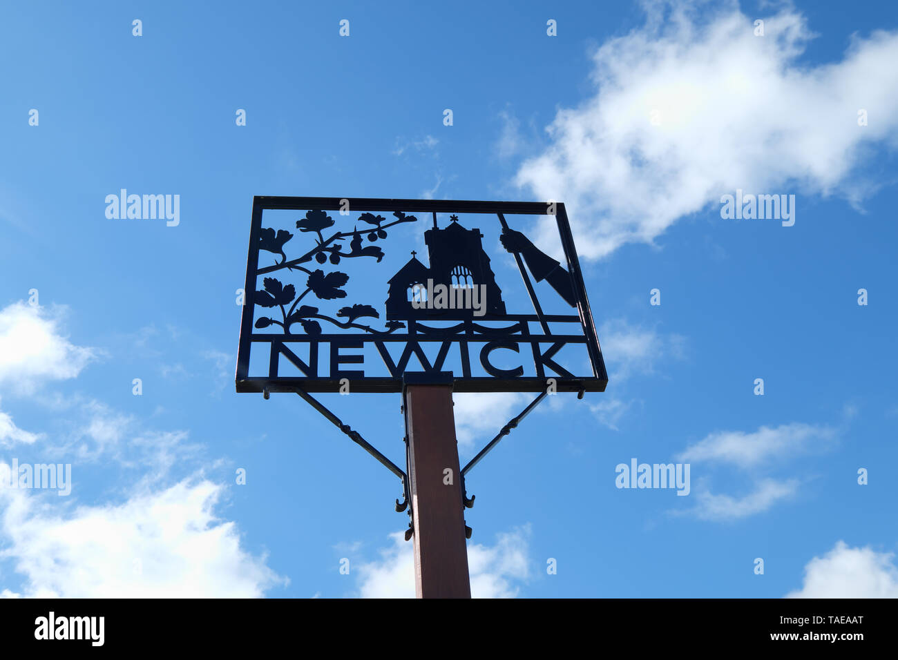sign for the village of newick in east sussex Stock Photo - Alamy