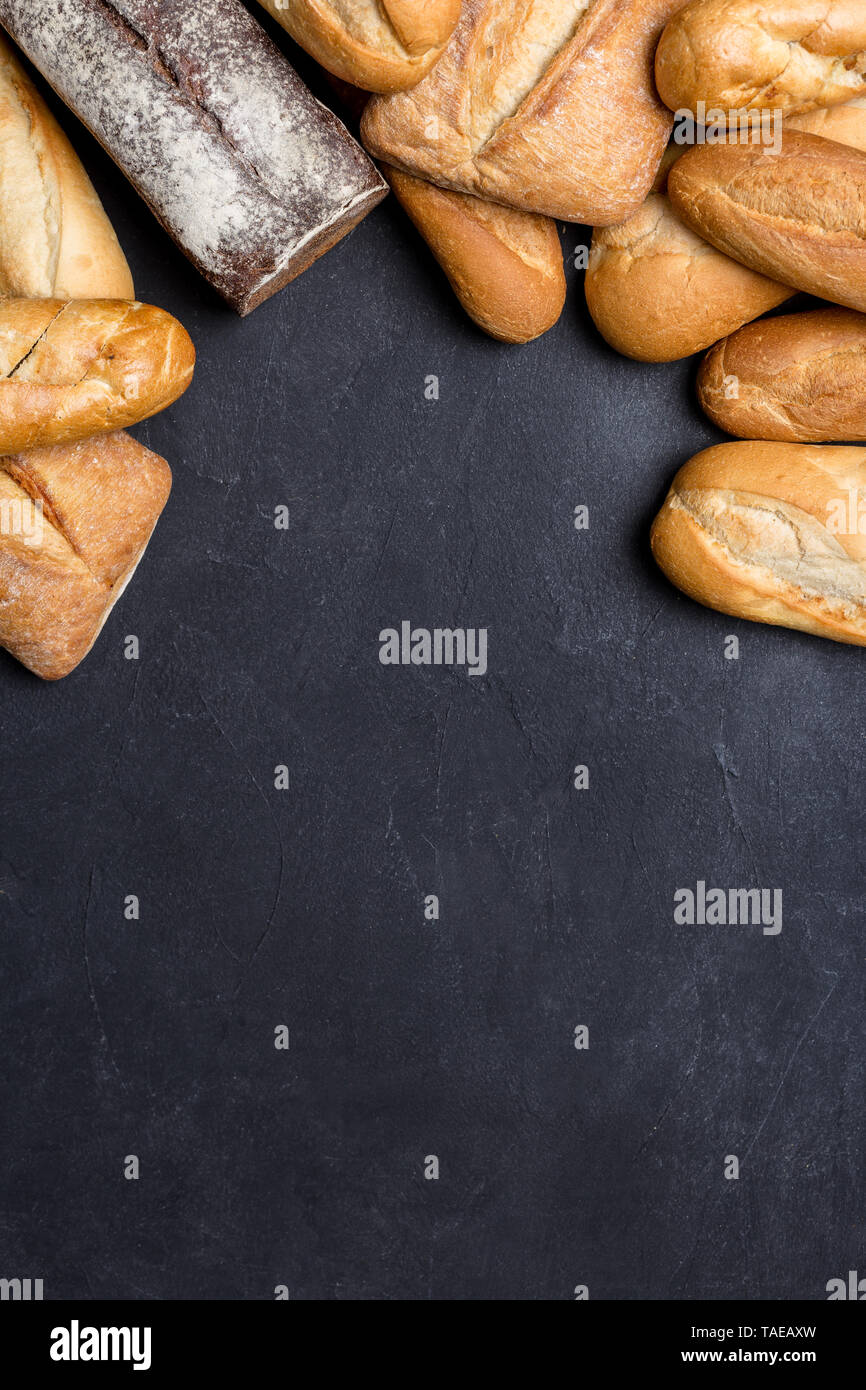 Vertical border with bread on dark background with copy space for text ...