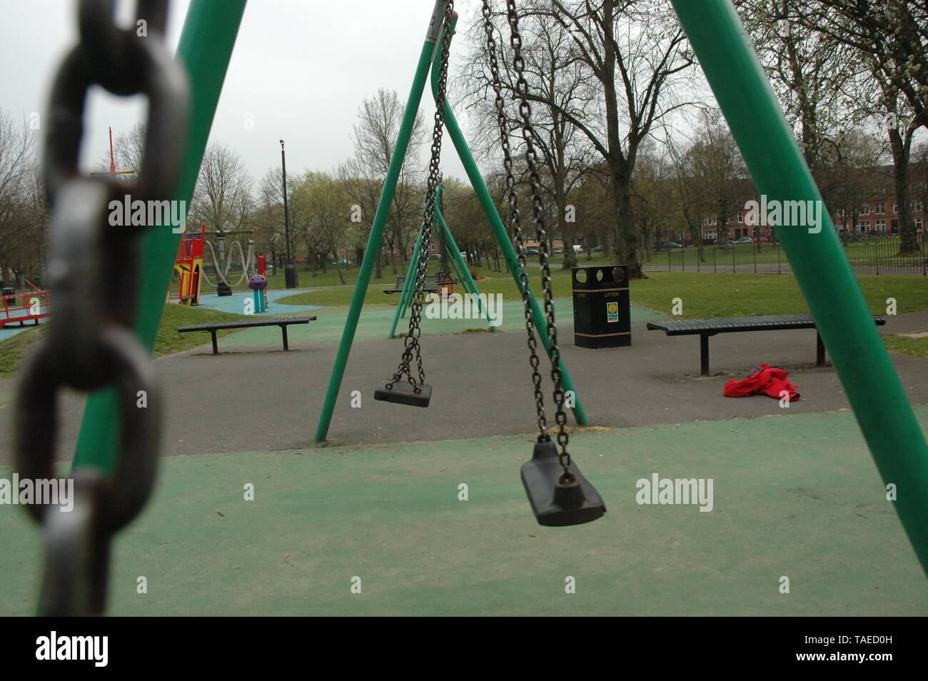 Red swings hi-res stock photography and images - Alamy