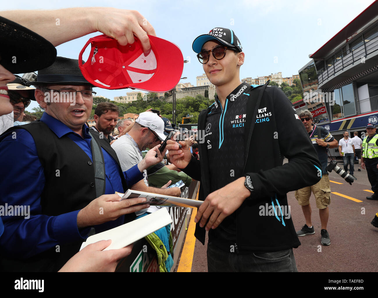 George Russell in the pitlane signing autographs during a preview day ...