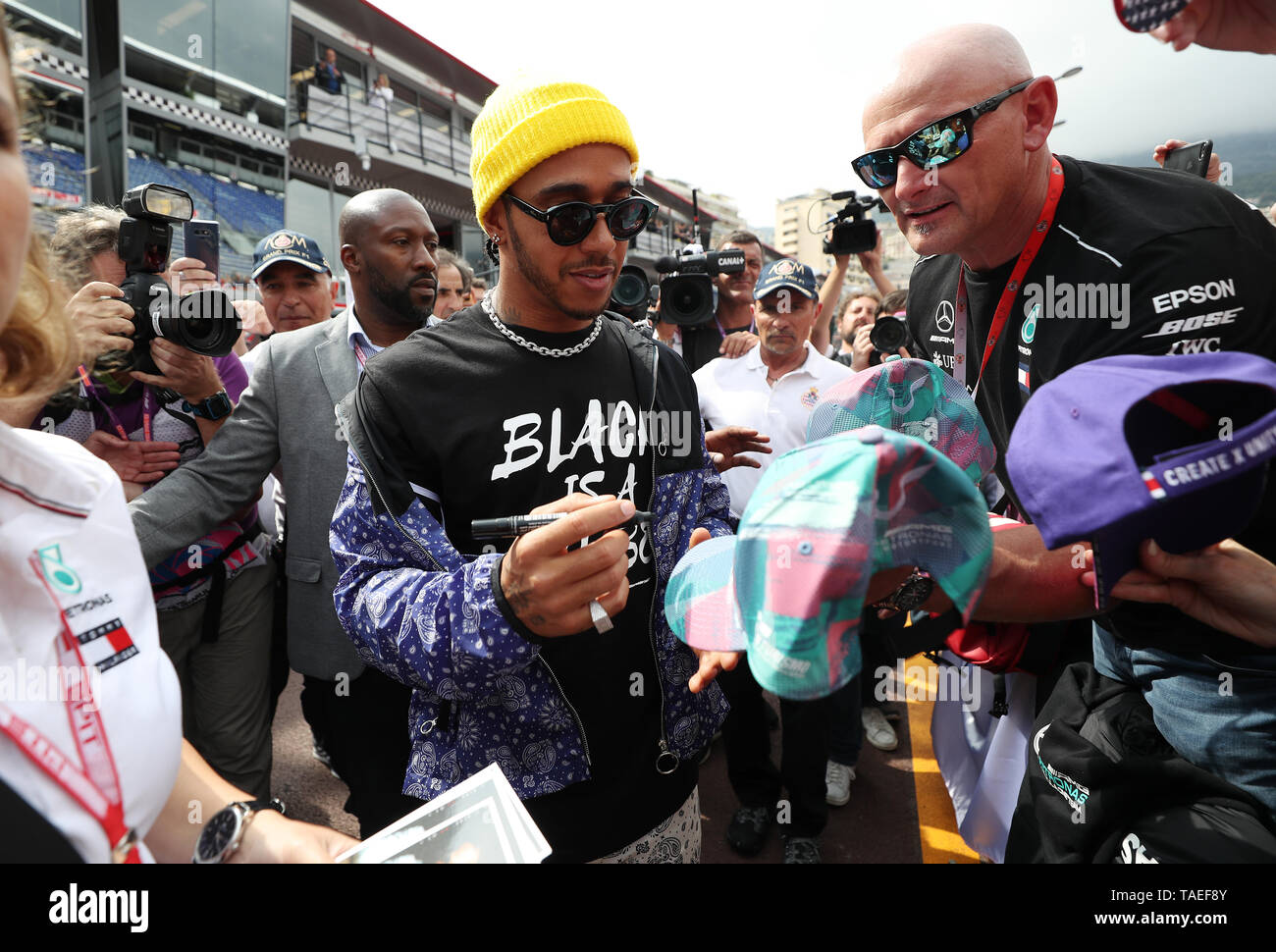 Lewis Hamilton in the pitlane signing autographs during a preview day ...