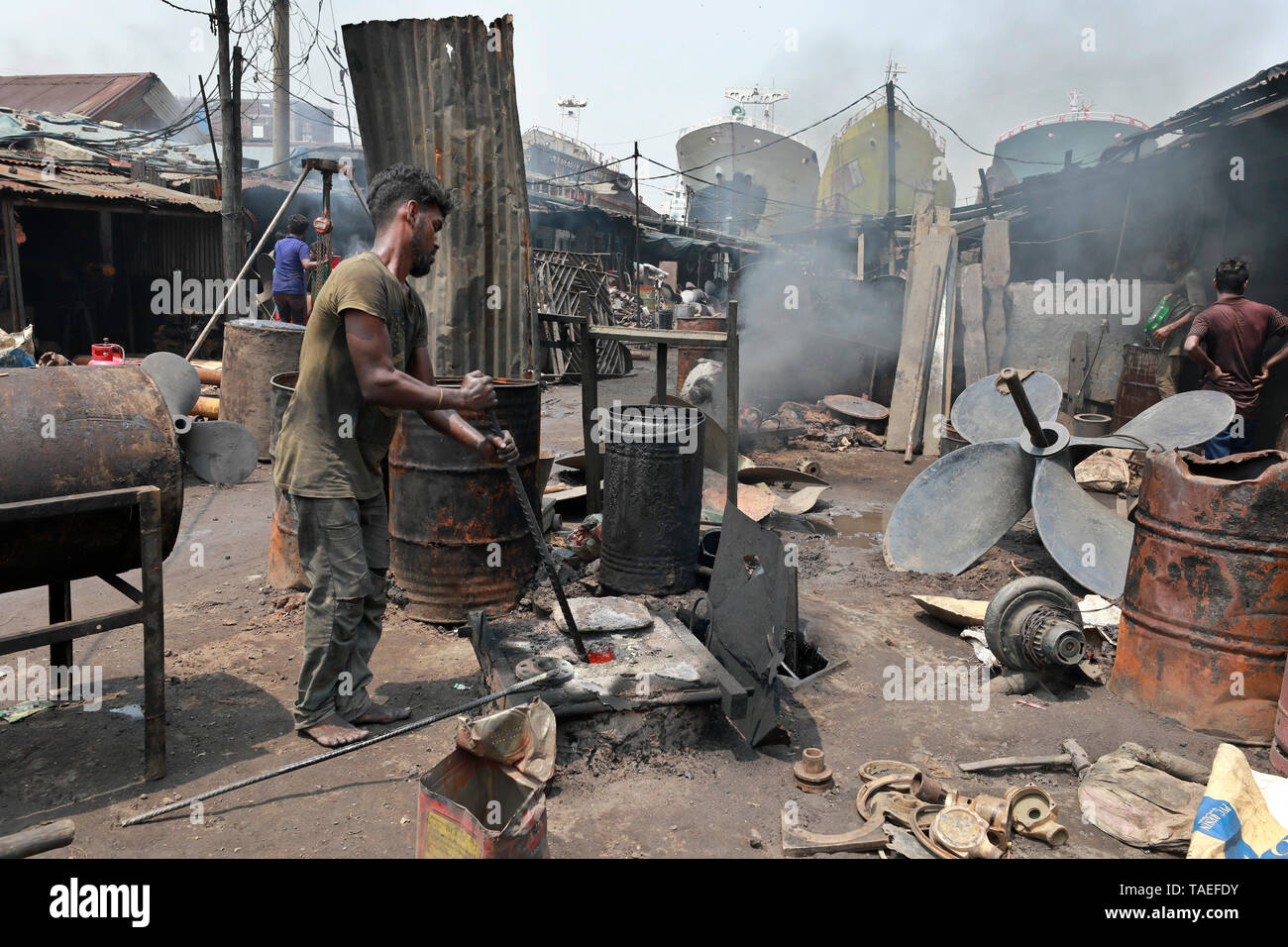 Dhaka, Bangladesh - May 23, 2019: Bangladeshi laborers works on a ferry ...