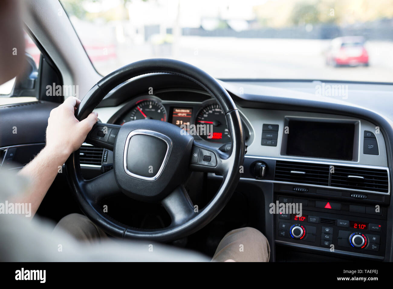 Man with short hair driving hi-res stock photography and images - Alamy