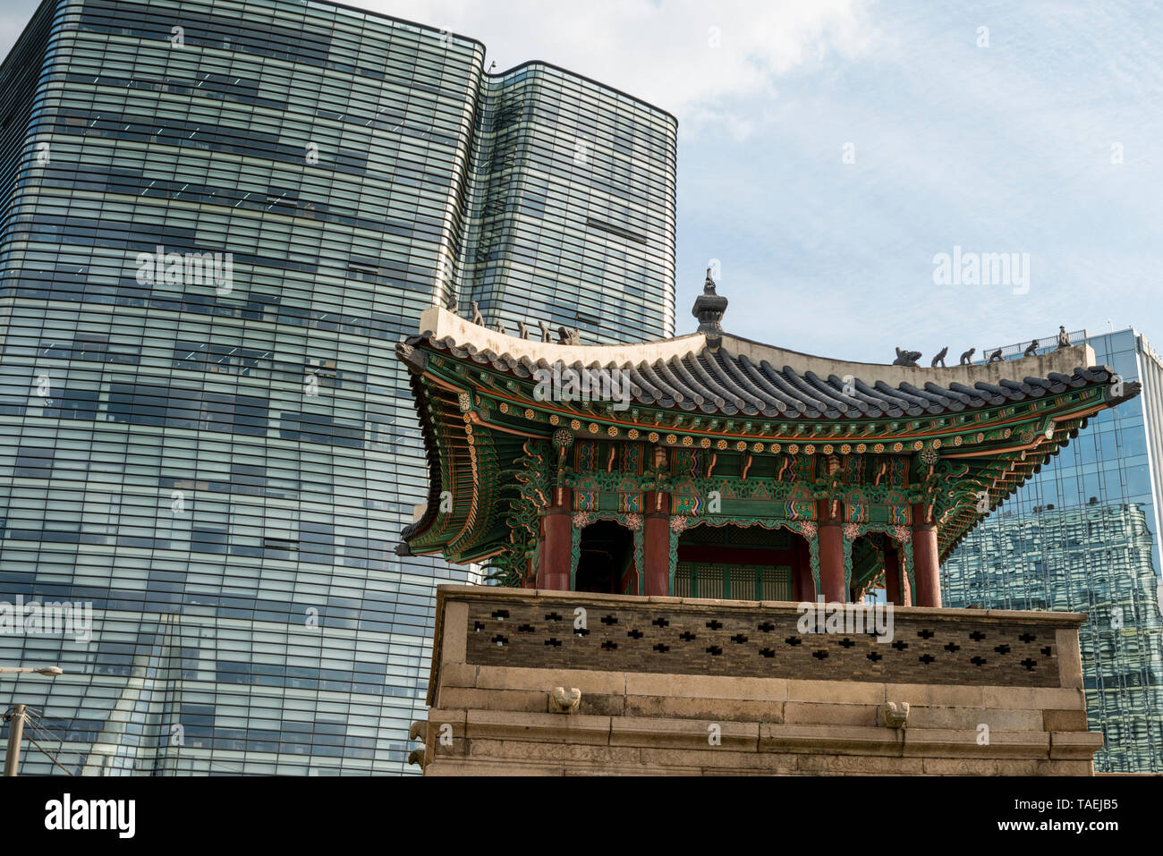 Traditional watchtower in front of skyscraper, Dongsibjagak Watchtower ...