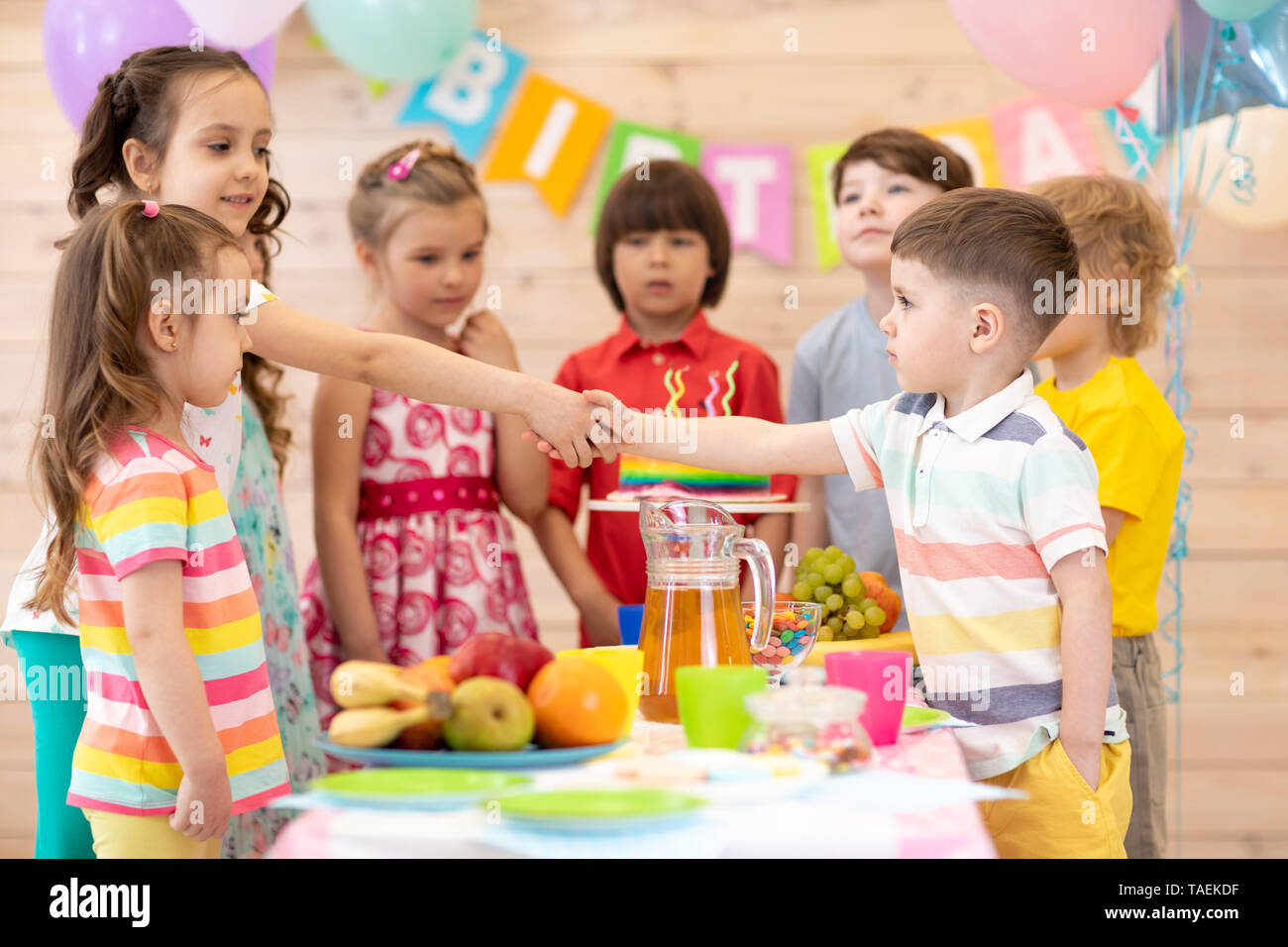 Groups of children come to parties and shake hands with birthday boy ...