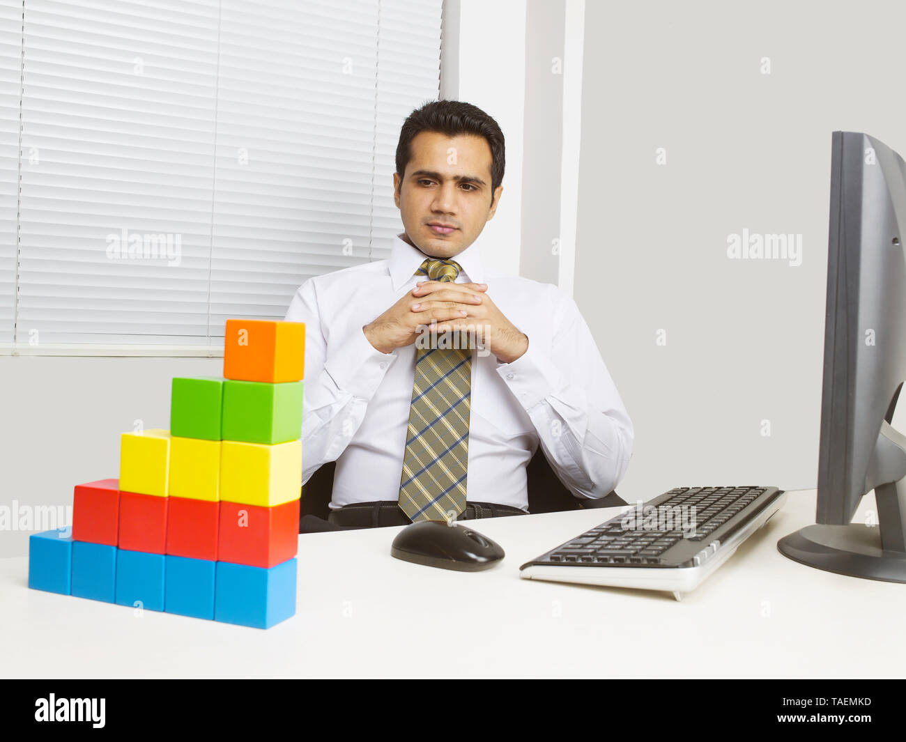 CORPORATE EXECUTIVE THINKING ON HIS DESK Stock Photo - Alamy
