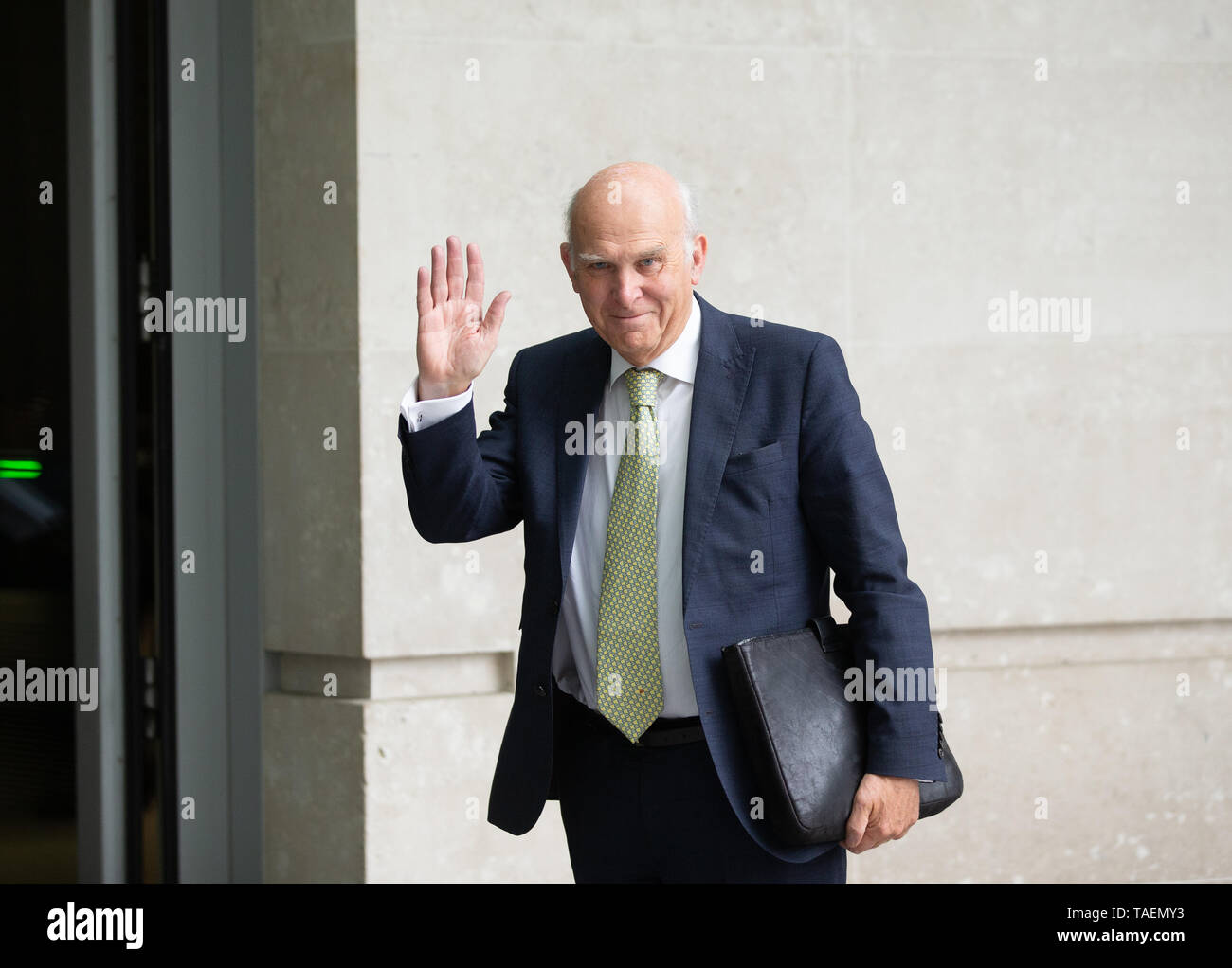 Vince Cable, Leader of the Liberal Democrats, waves as he arrives at ...