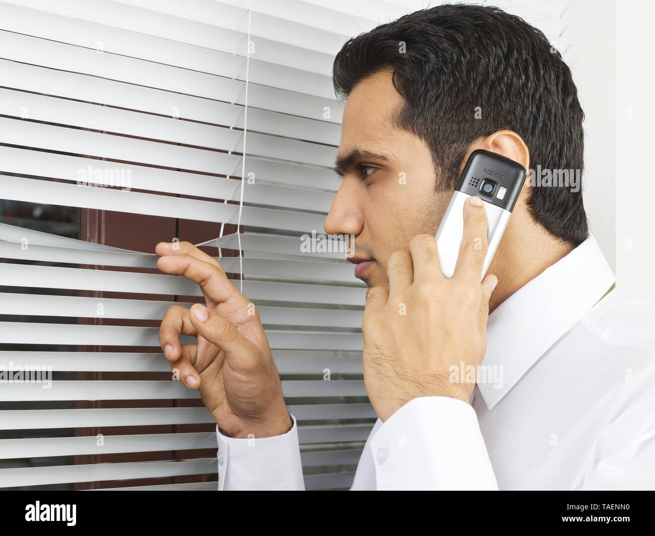 CORPORATE EXECUTIVE talking on mobile Stock Photo - Alamy