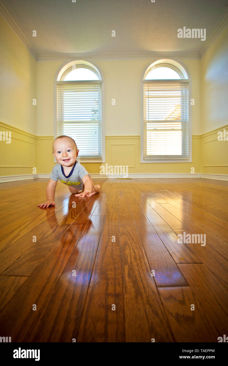 infant boy in an empty room Stock Photo - Alamy