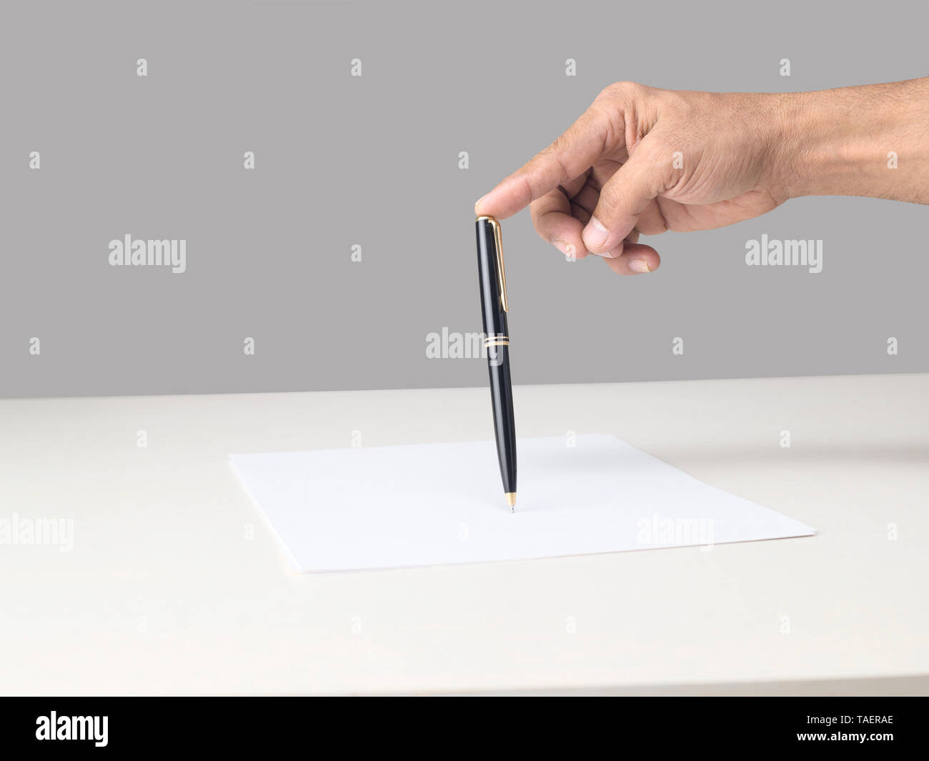 STILL LIFE OF A MAN HOLDING A PEN Stock Photo - Alamy
