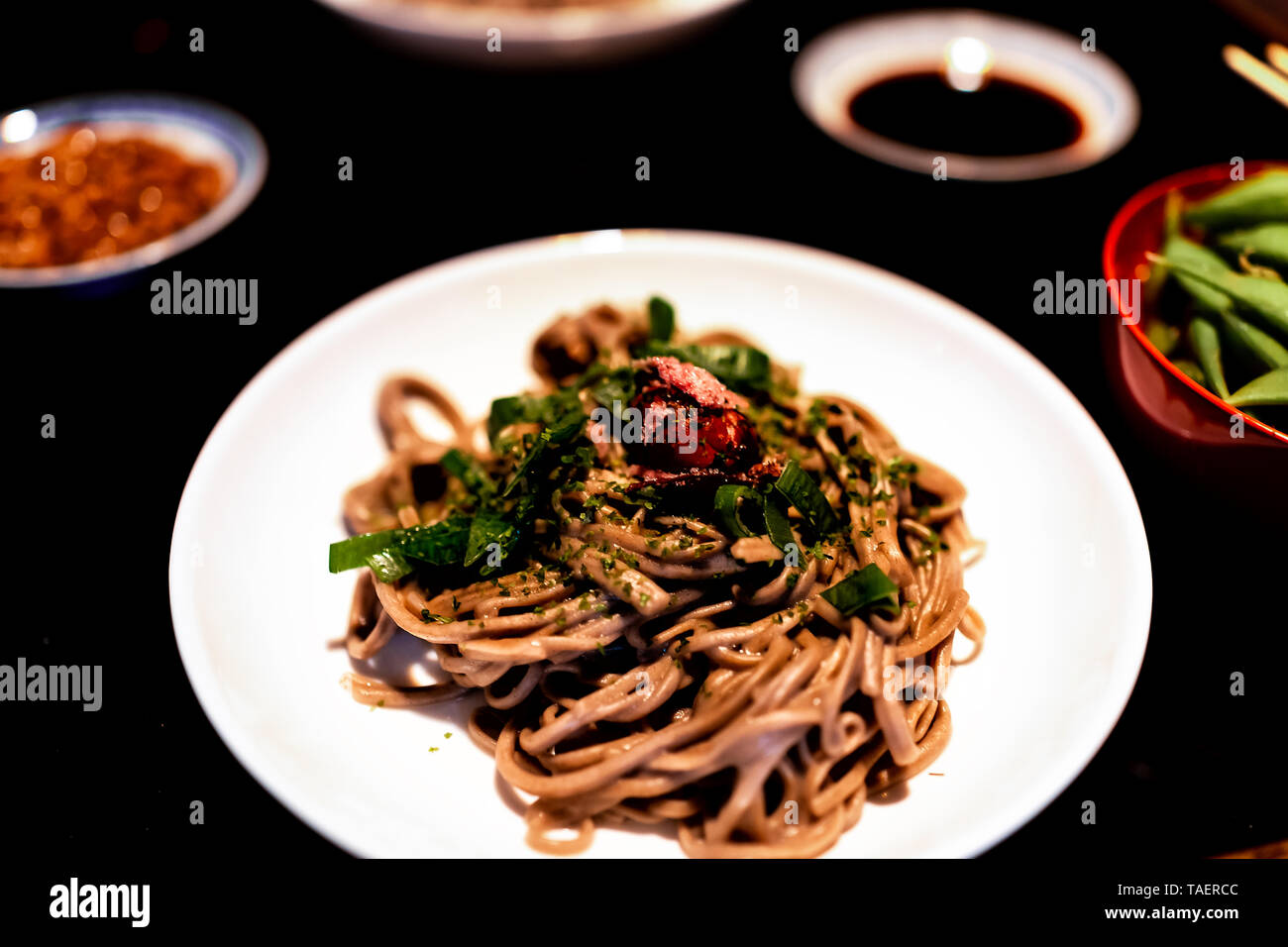 Traditional japanese plate with black lacquered wood table background ...