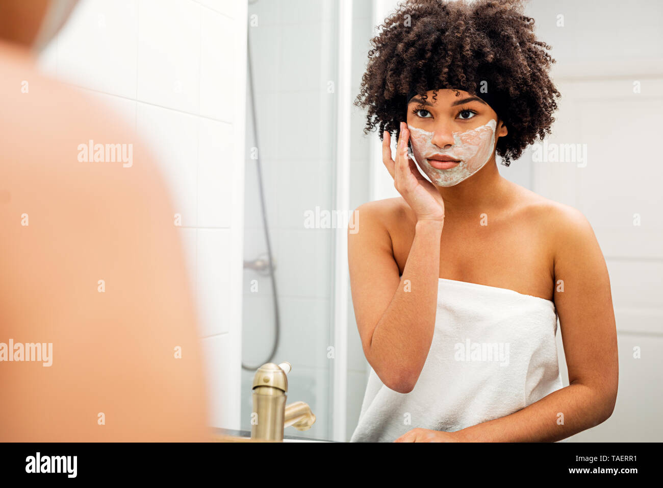 Applying facial mask hi-res stock photography and images - Alamy