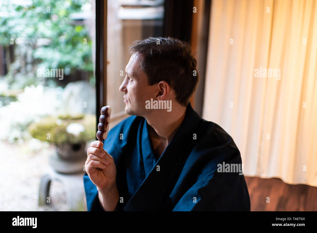 Traditional japanese house or ryokan restaurant with man in kimono or ...