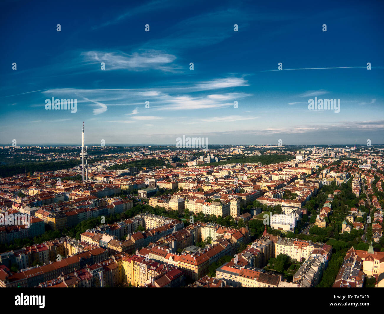 aerial view of zizkov tv tower in prague under bright sky and clouds ...