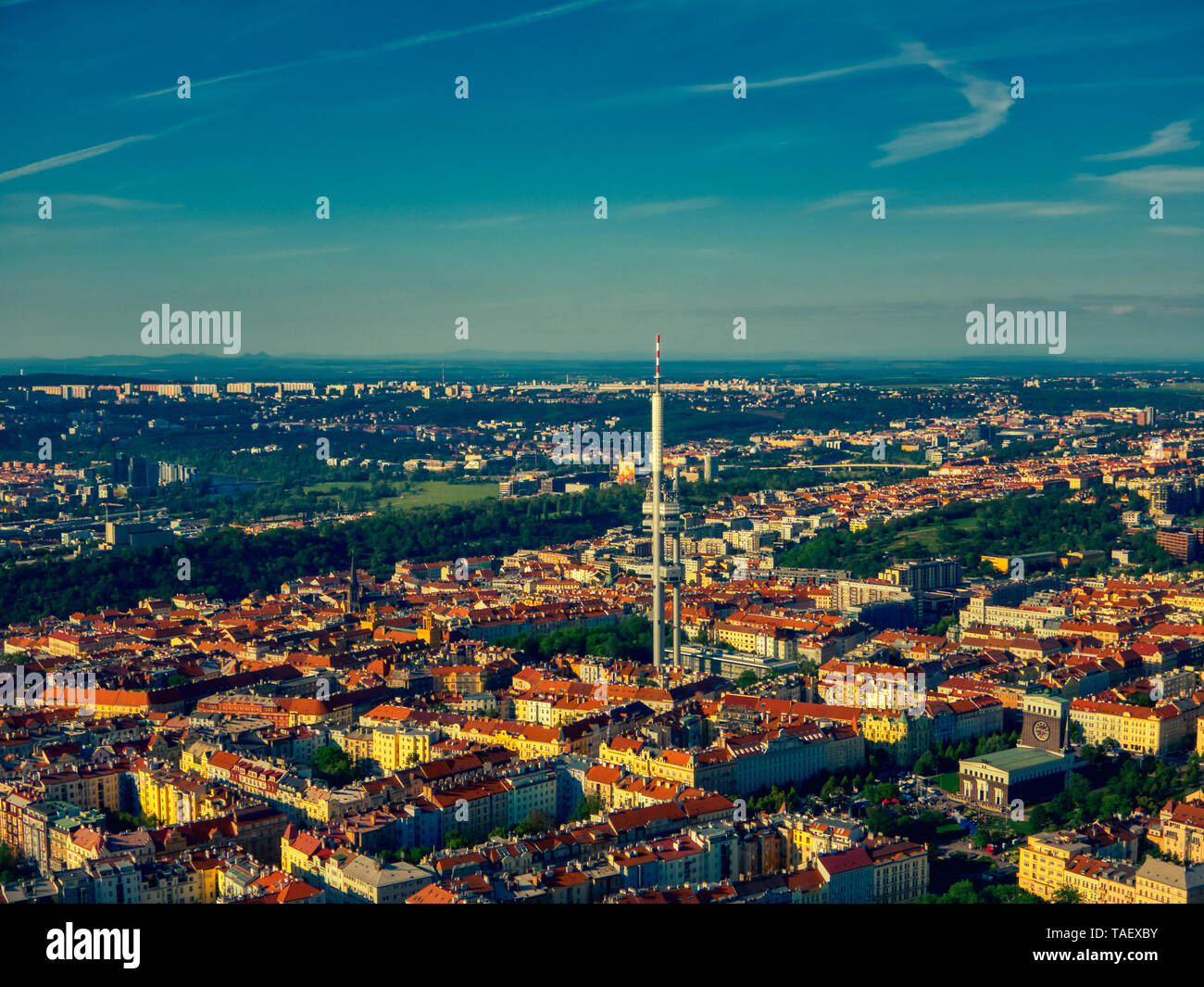 aerial view of zizkov tv tower in prague under bright sky and clouds ...