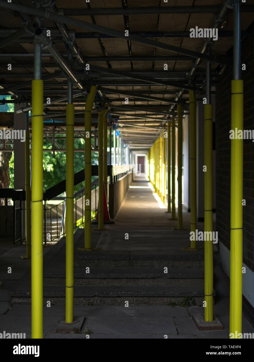 Perspective view of an industrial building's concrete corridor under ...