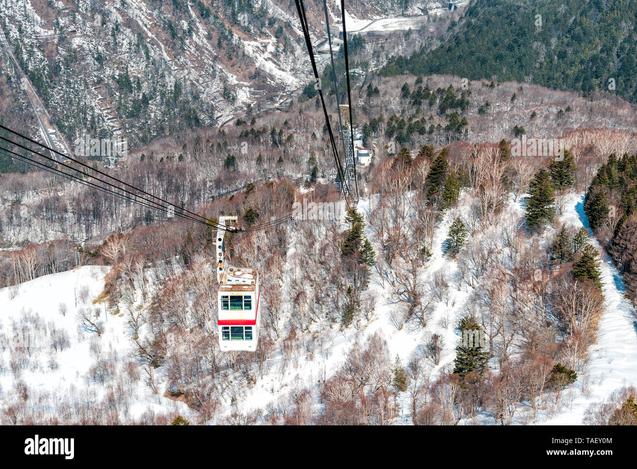 Takayama, Japan Mountain with snow and red car in Shinhotaka Ropeway ...